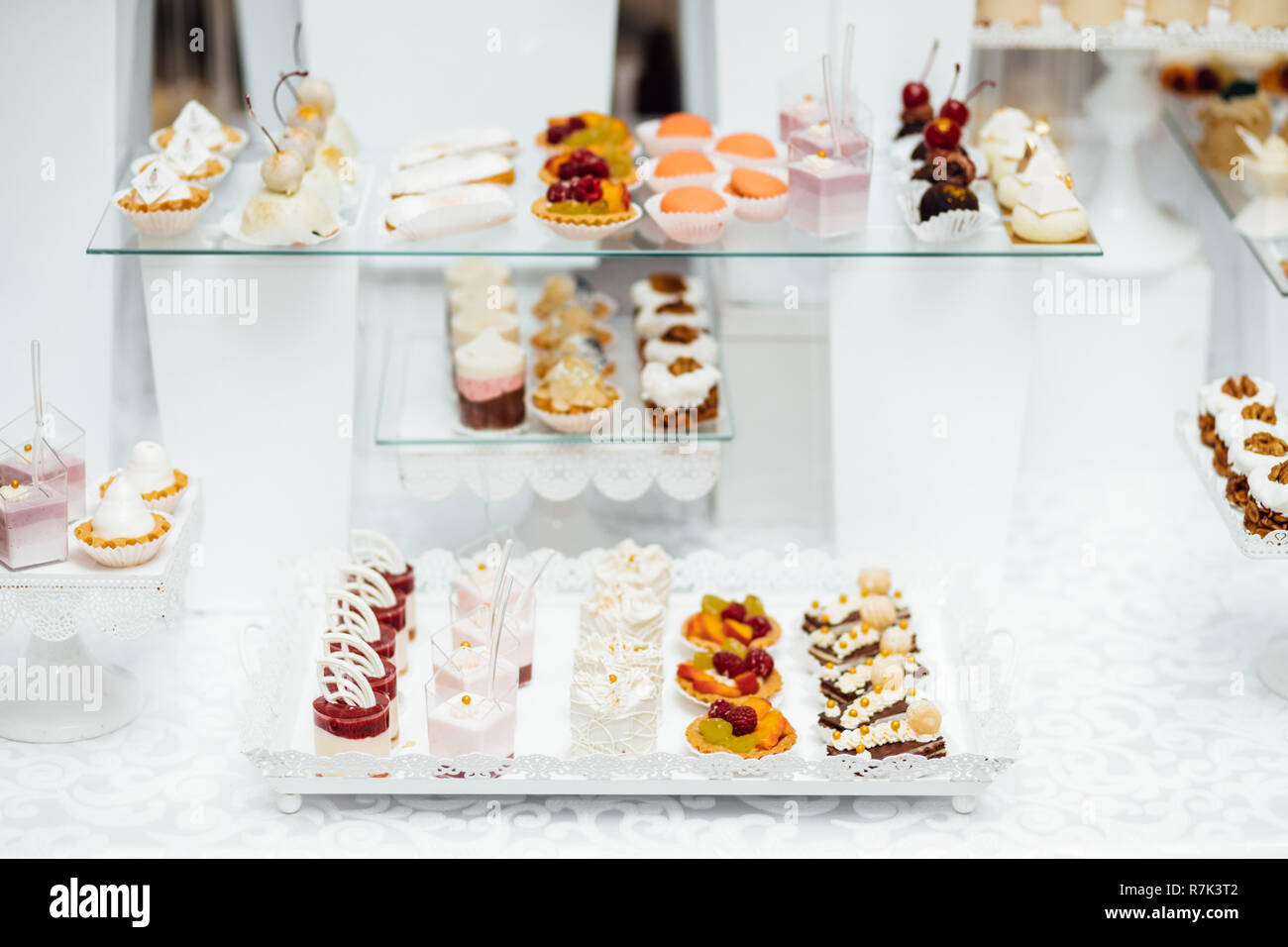 Table with different sweets for party. Candy bar Stock Photo - Alamy