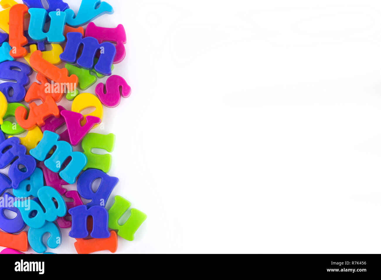 Colourful plastic letters isolated on white.Concept of education ...