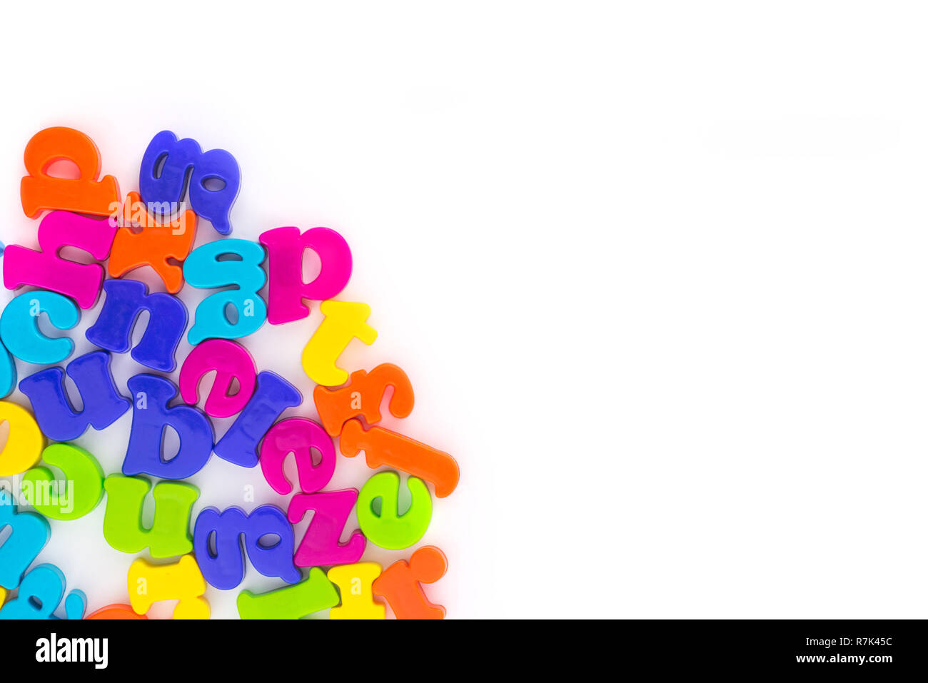 Colourful plastic letters isolated on white.Concept of education ...