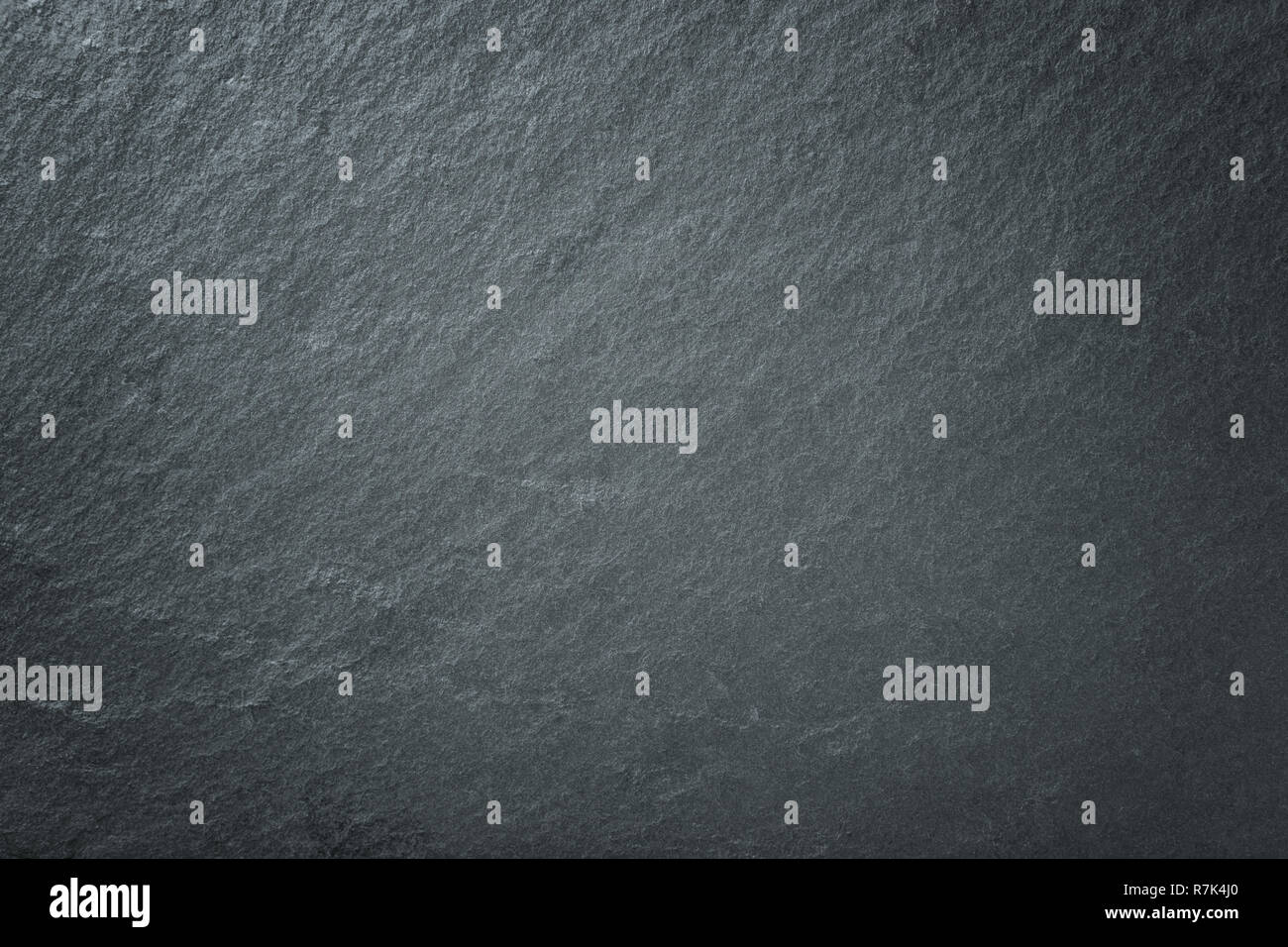 Light gray background of natural slate. Texture of black stone closeup ...