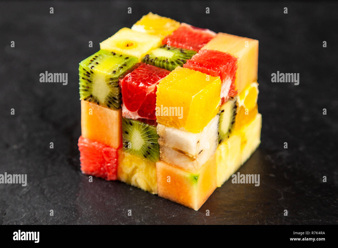 Fruit cube isolated on white background Stock Photo - Alamy
