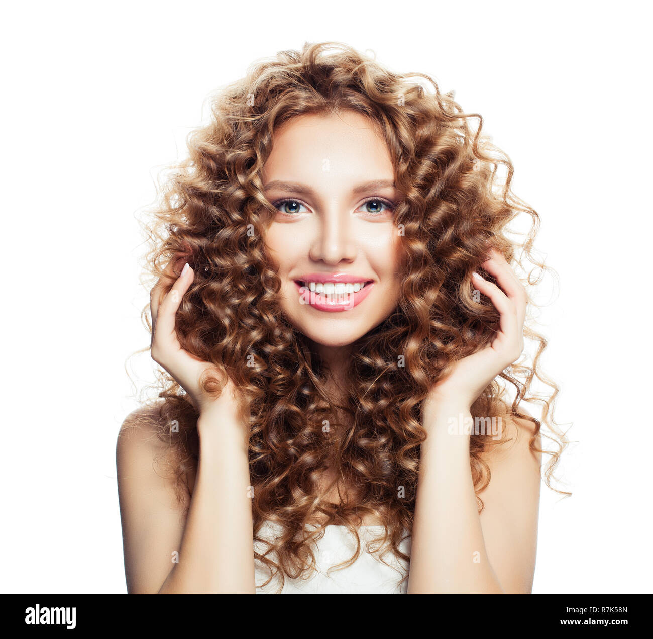 Beautiful female model with healthy skin and curly hair. Friendly ...