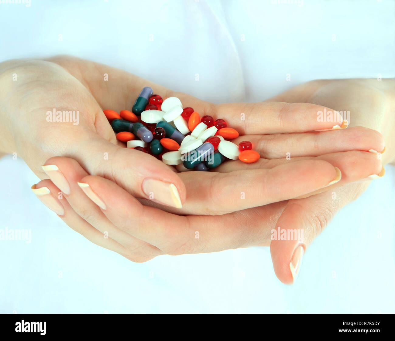Hand holding stack of tablets hi-res stock photography and images - Alamy