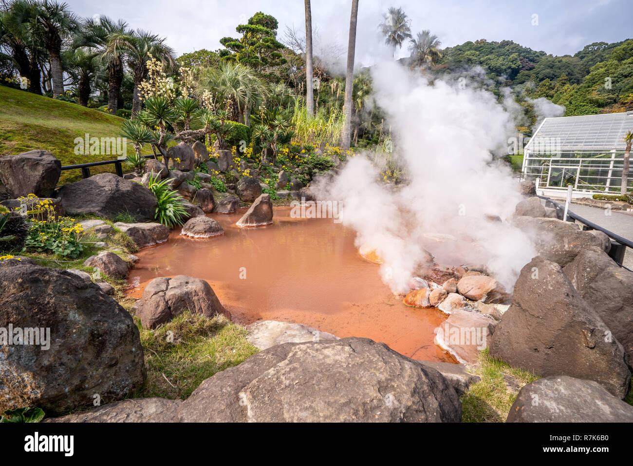 Red hot spring near UMI JIGOKU (Sea Hell) pond in autumn, which is one ...