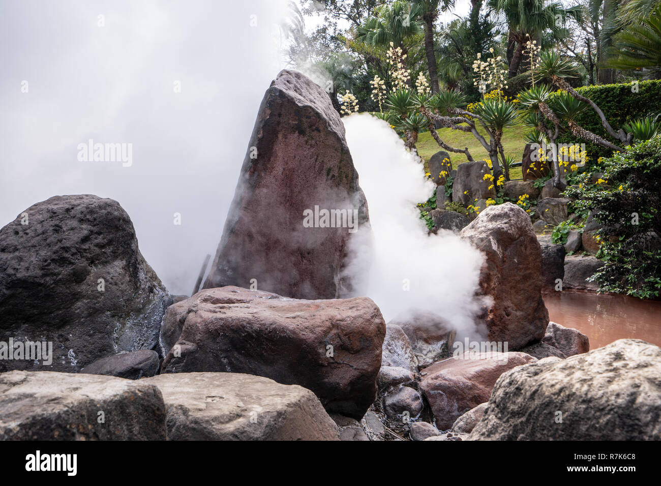Red hot spring near UMI JIGOKU (Sea Hell) pond in autumn, which is one ...