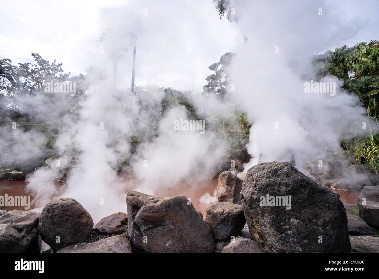 Red hot spring near UMI JIGOKU (Sea Hell) pond in autumn, which is one ...