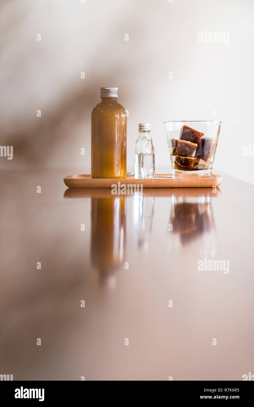 Coffee Cube Latte served with coffe ice cube and milk Stock Photo - Alamy