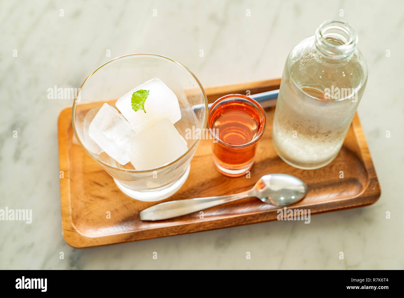 Lime ice Cube juice serve with soda water mojito Stock Photo - Alamy
