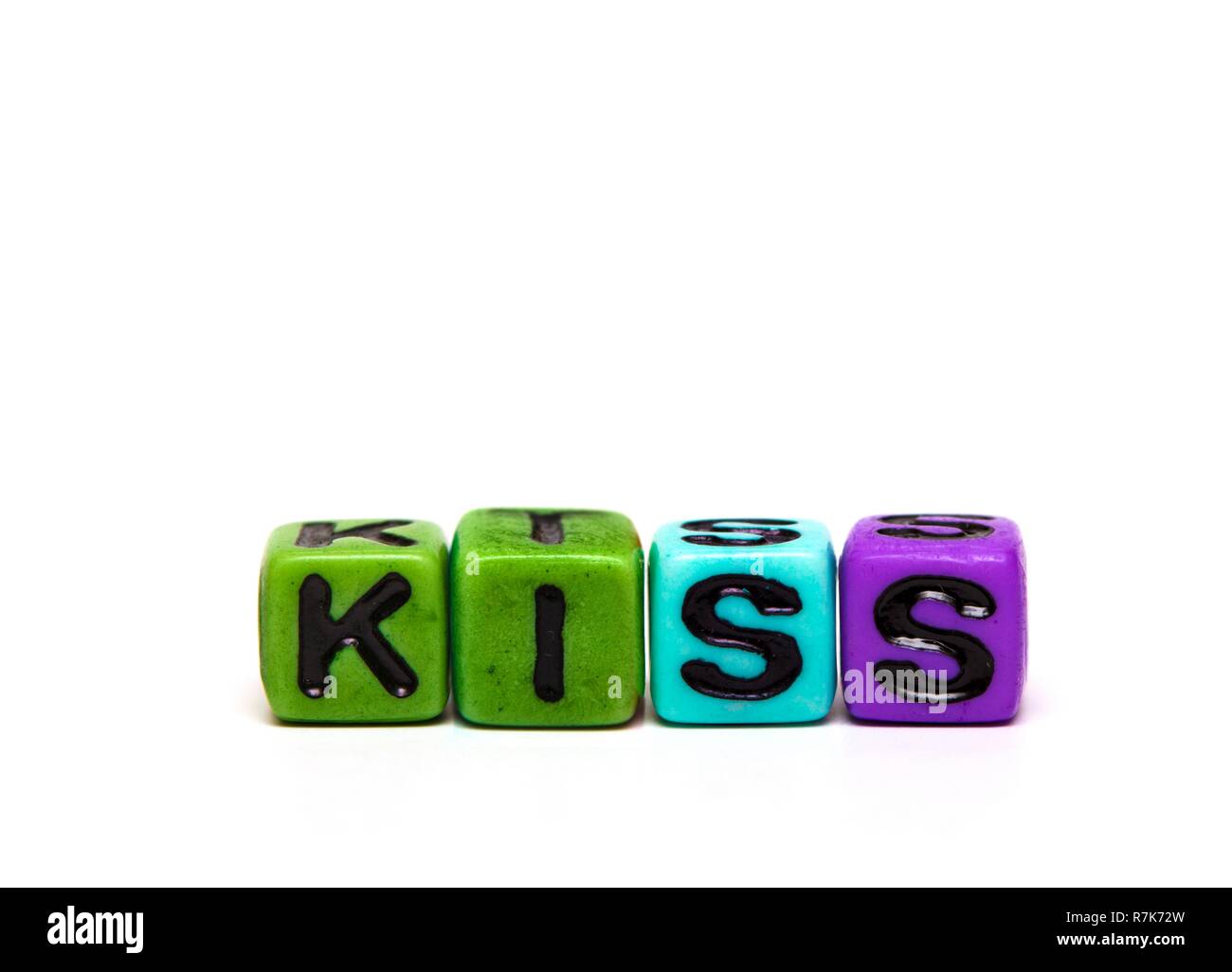 kiss - word made from multicolored child toy cubes with letters Stock ...