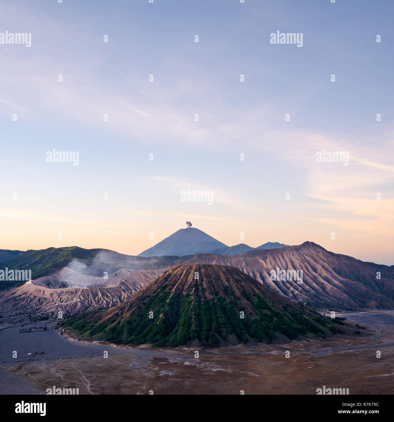 Mount Bromo volcano crater erupts in the caldera, behind Gunung Batok ...