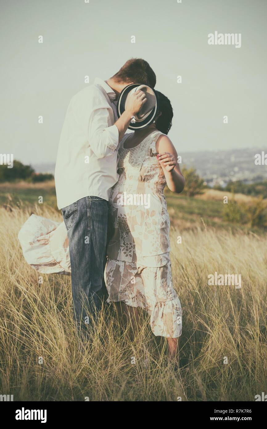 Boy girl kissing hat hi-res stock photography and images - Alamy