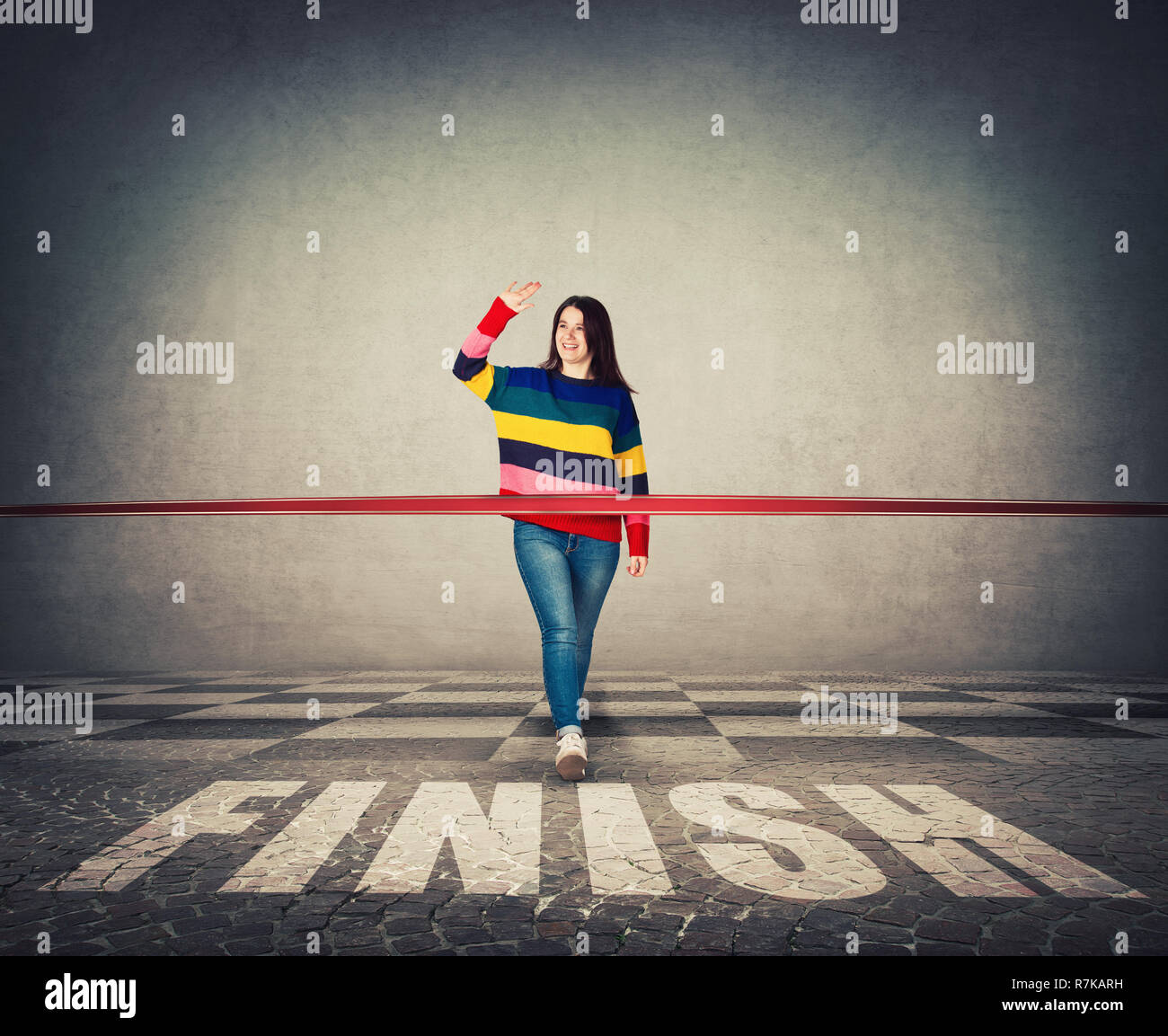 Winning young woman, smiling broadly celebrate waving palm raised up ...