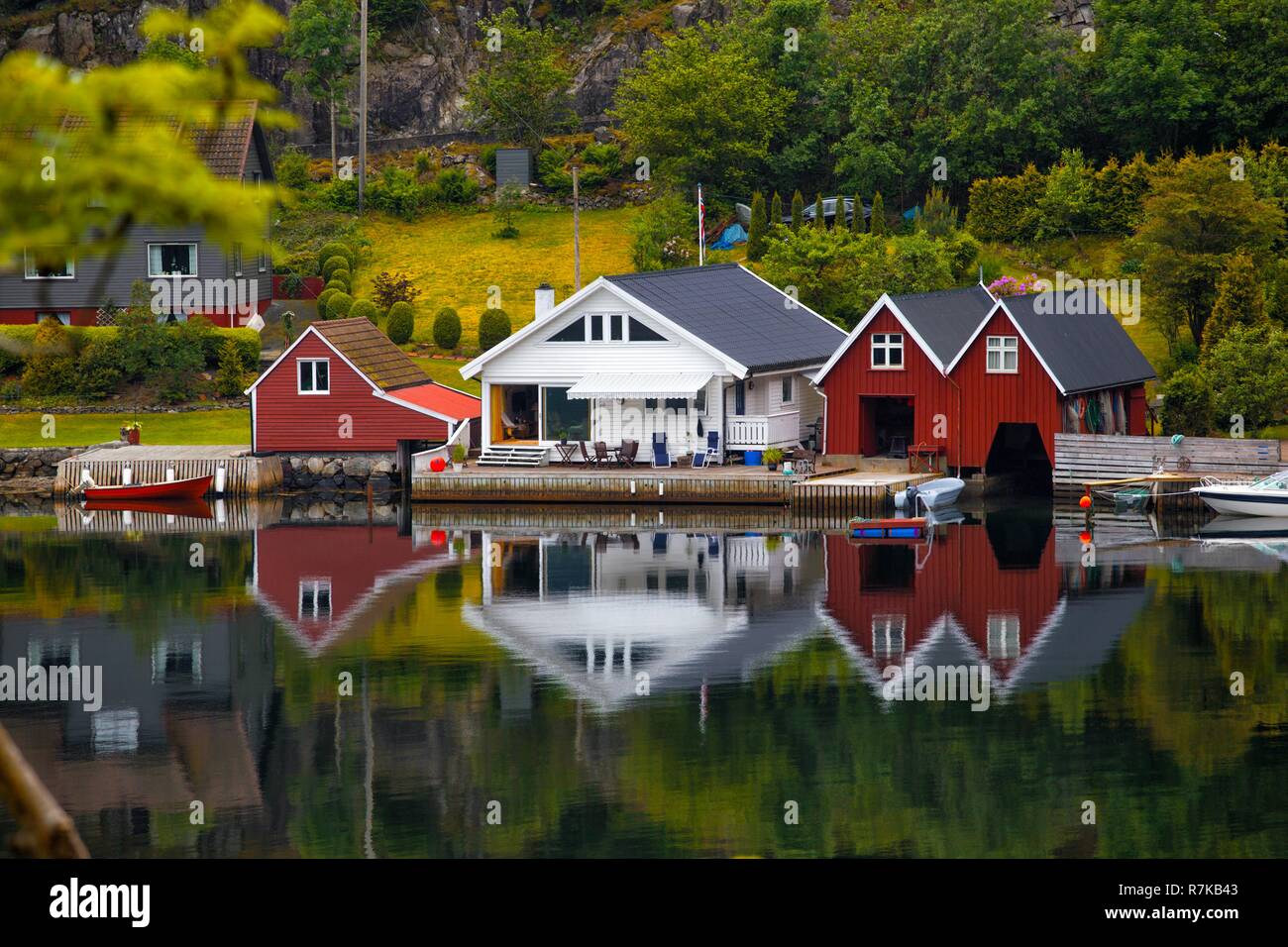 traditional norwegian wooden house to stand at the lakeside and ...