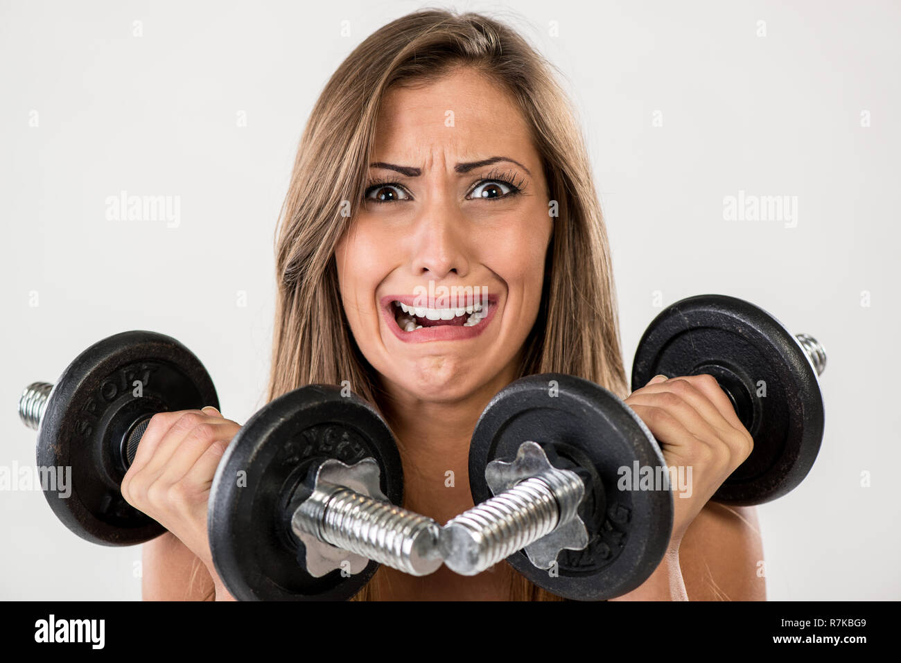 Girl lifting up weights hi-res stock photography and images - Alamy