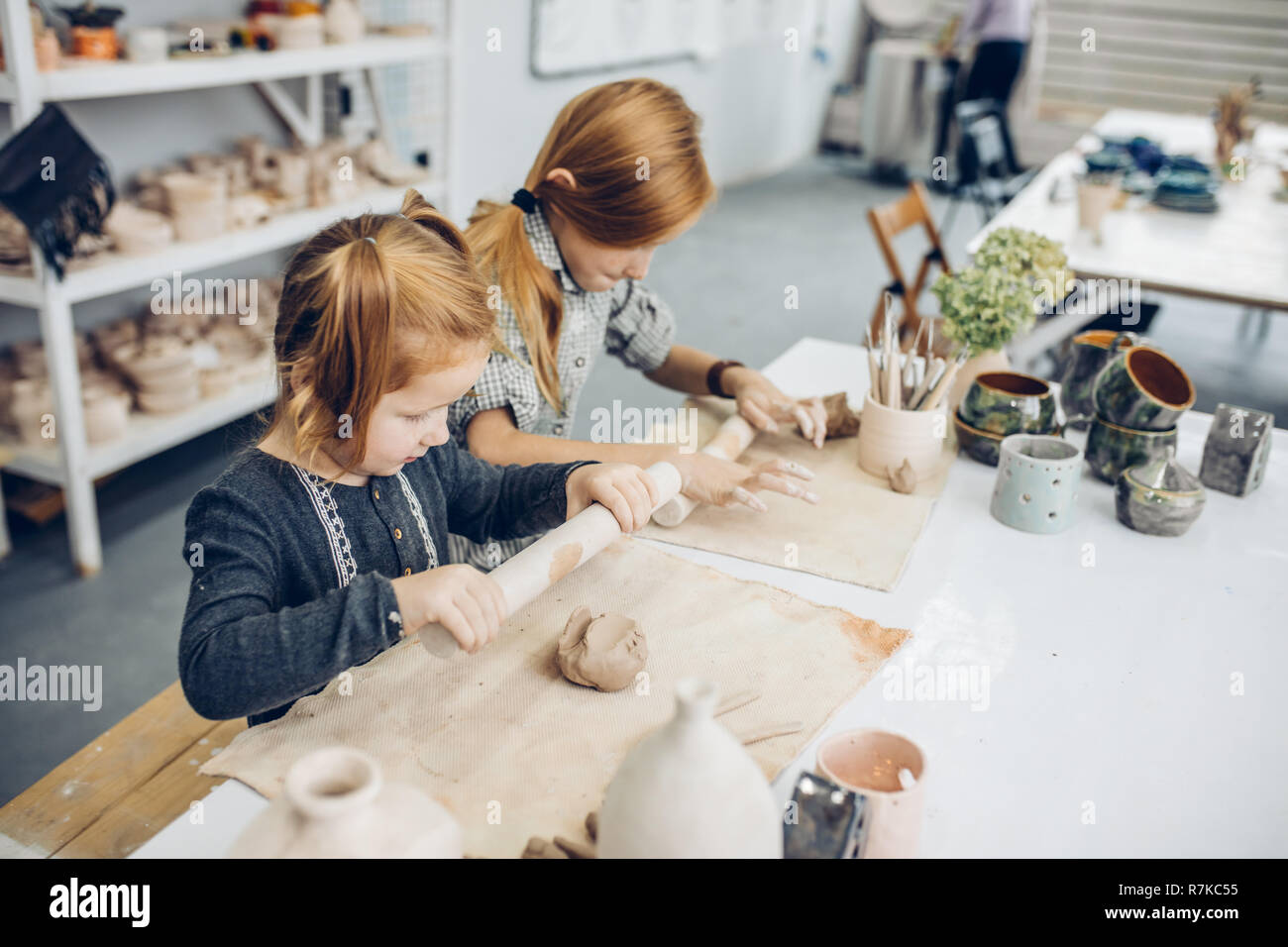 kids are working with a rolling pin Stock Photo - Alamy