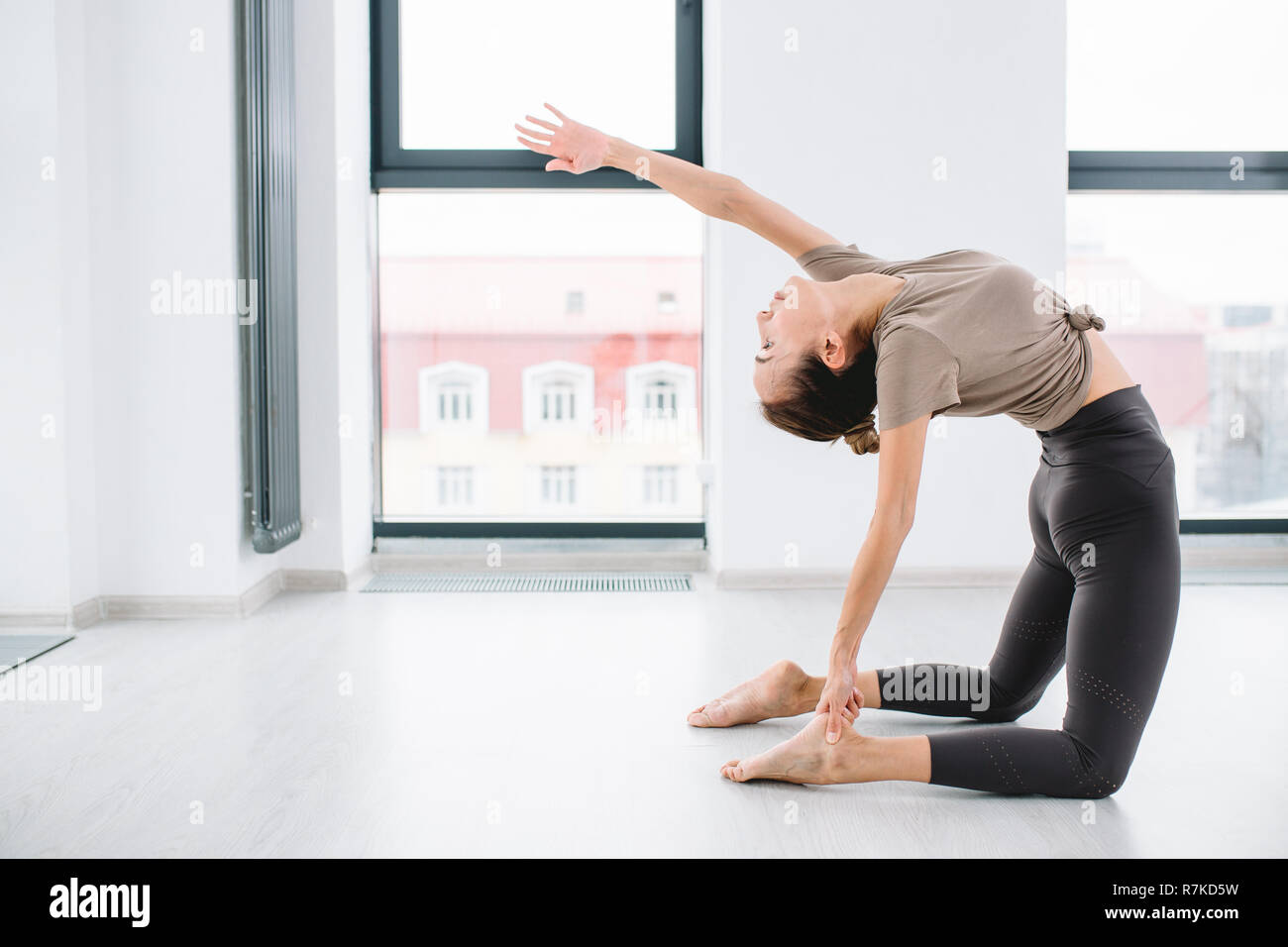 dancing woman doing movement with bent back Stock Photo - Alamy