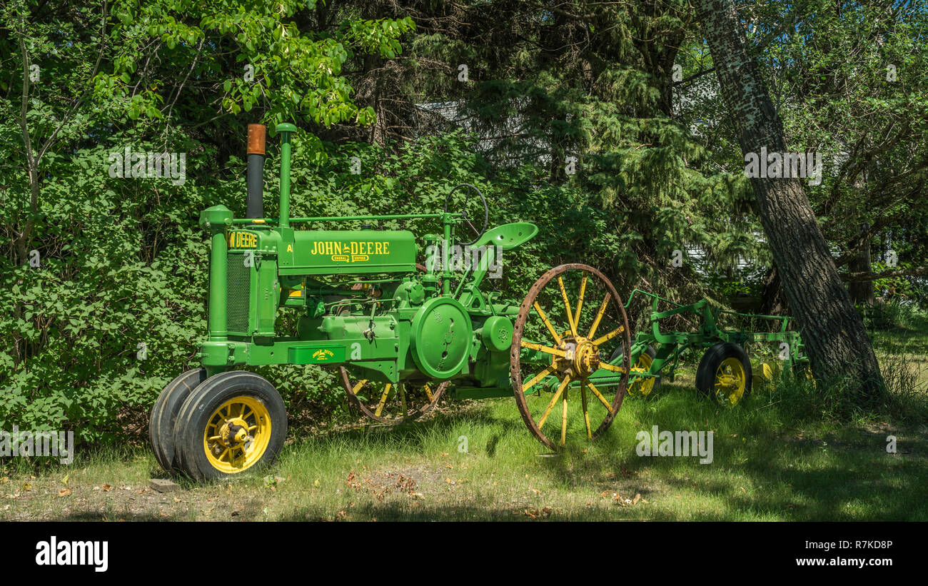 A vintage John Deere tractor and plow near Osterwick, Manitoba, Canada ...