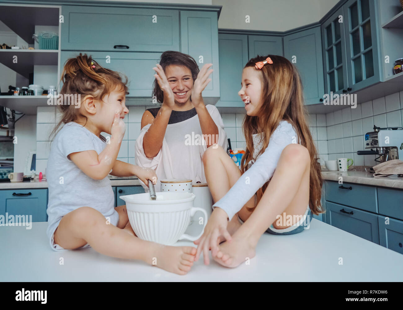 Happy family cook together in the kitchen Stock Photo - Alamy