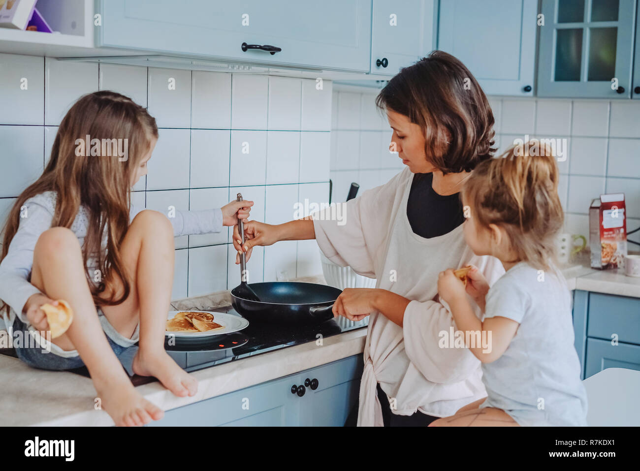 happy family cook together in the kitchen Stock Photo - Alamy