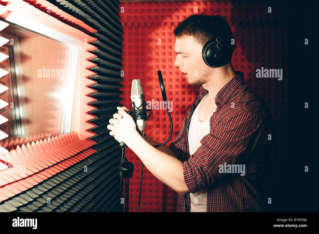 emotional awesome man performing a song in the recording studio Stock ...