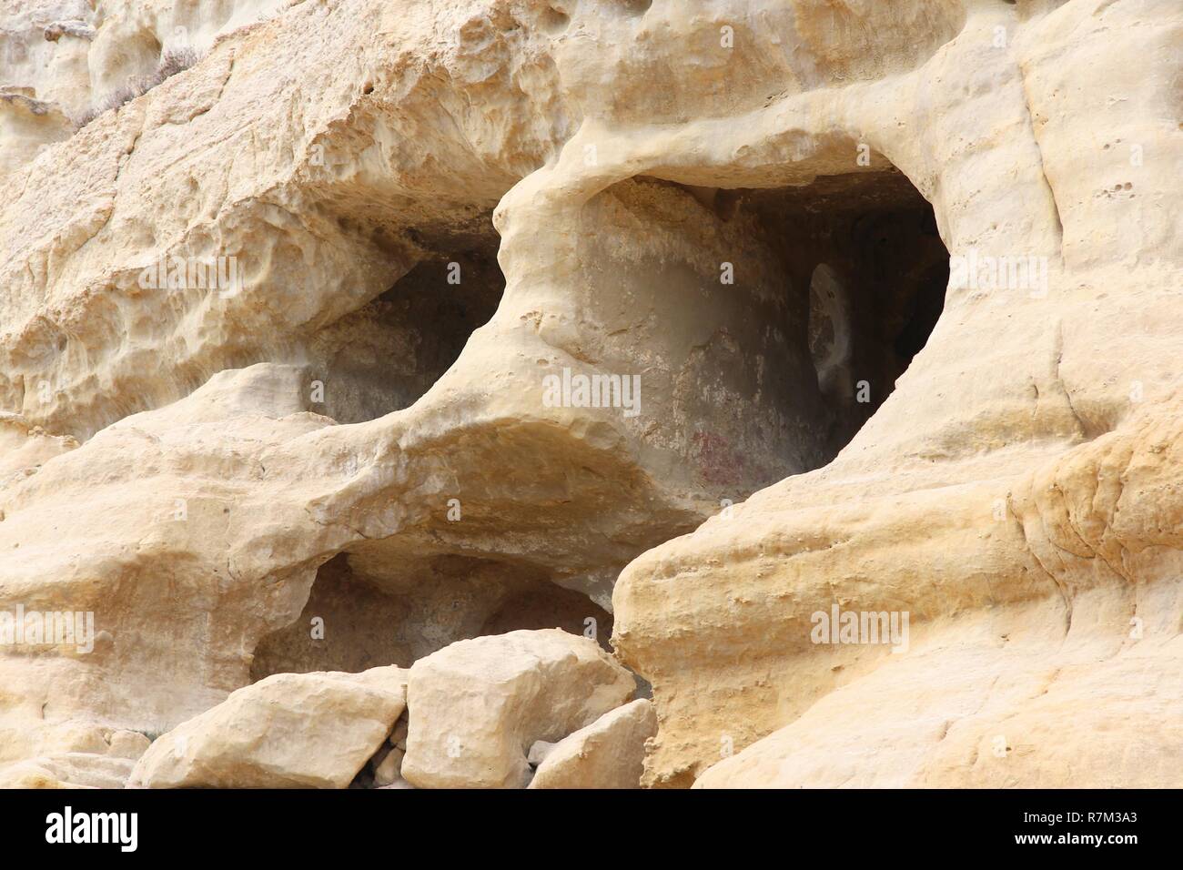 Coast of Crete island in Greece. Famous rock hewn ancient caves in ...