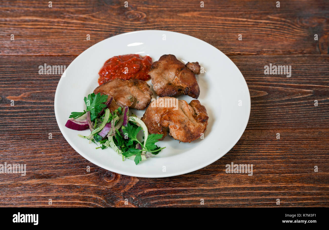 Roasted pork neck on a plate Stock Photo - Alamy