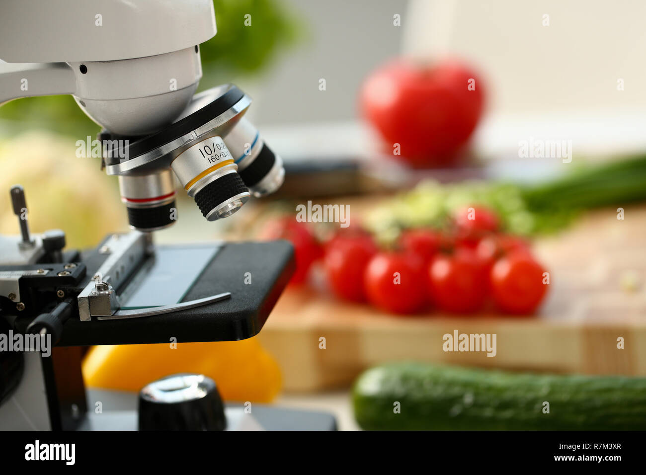 Microscope head on kitchen background Stock Photo - Alamy