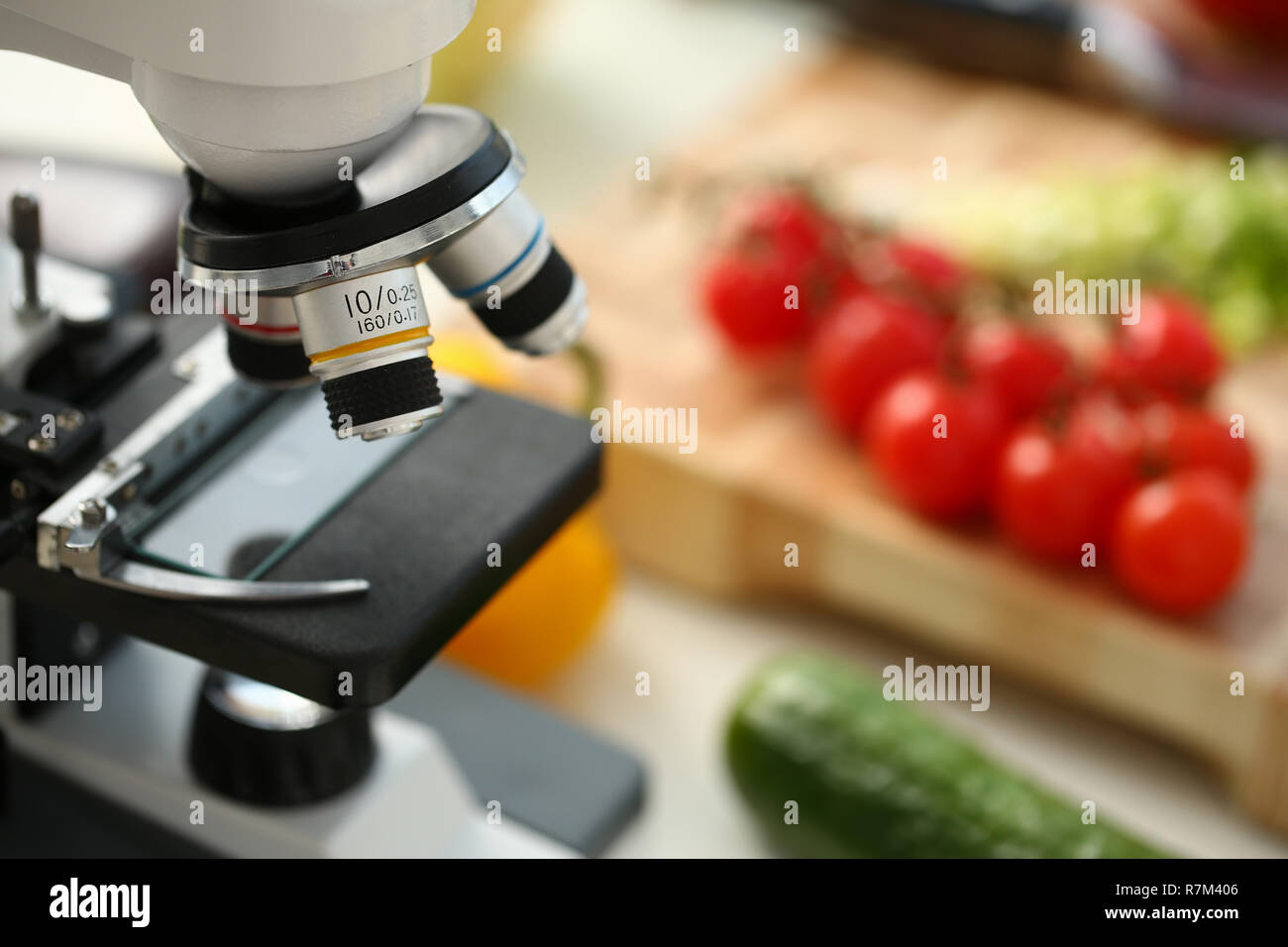 Microscope head on kitchen background Stock Photo - Alamy
