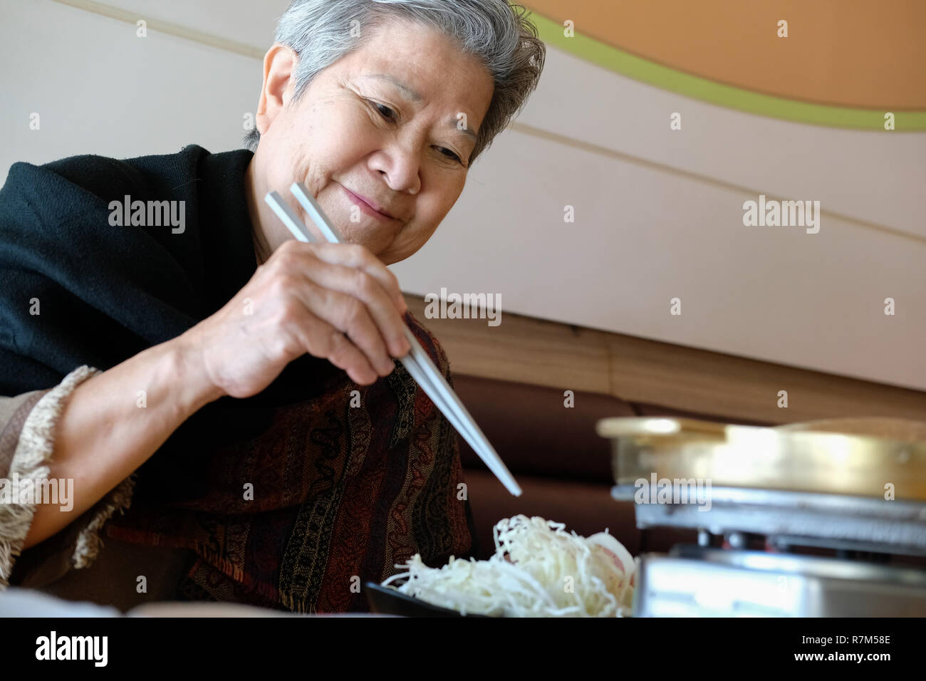 Senior woman eating breakfast older hi-res stock photography and images ...