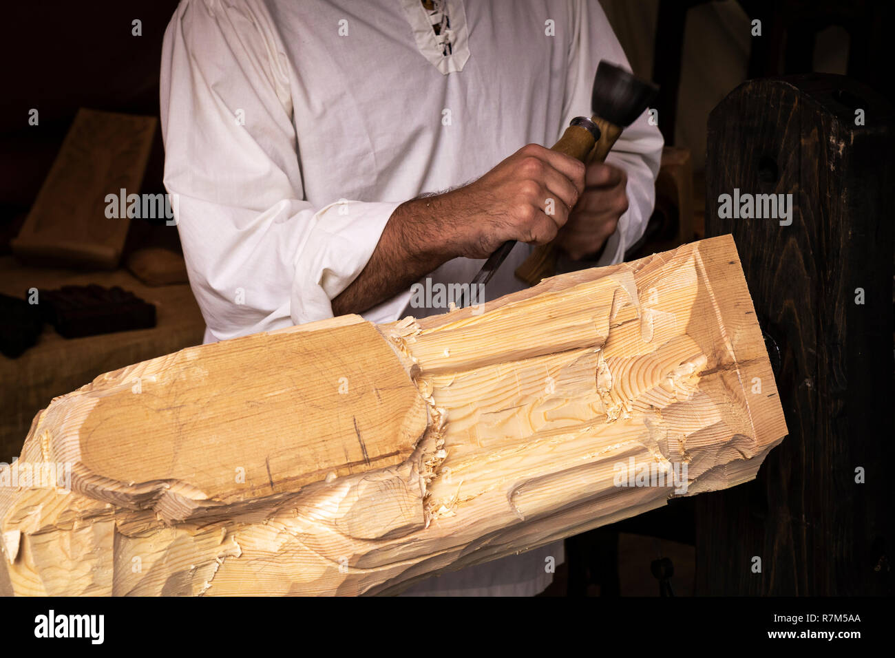 carpenter's hands working a piece of wood in an old carpentry Stock ...