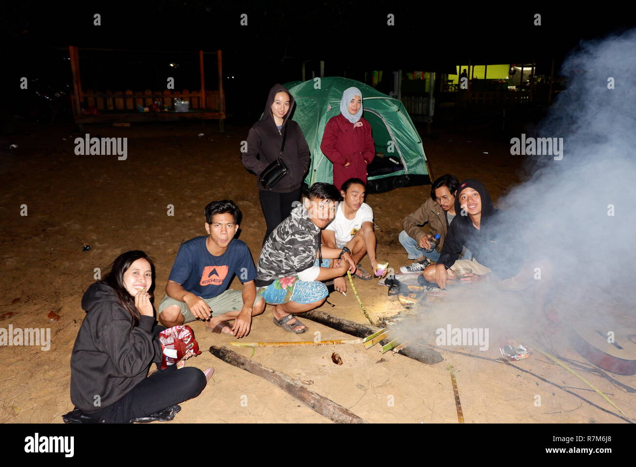 Group Friends Around Campfire High Resolution Stock Photography and ...