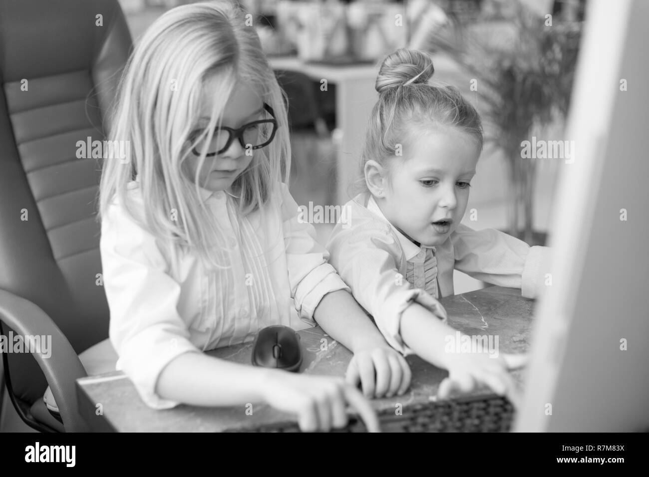 Little children on business meeting sharing ideas in office and using ...