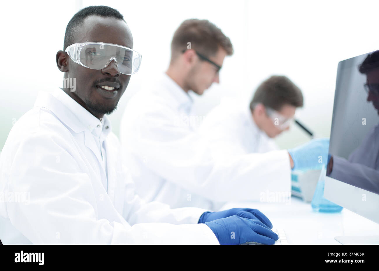 promising scientist working on a computer Stock Photo - Alamy