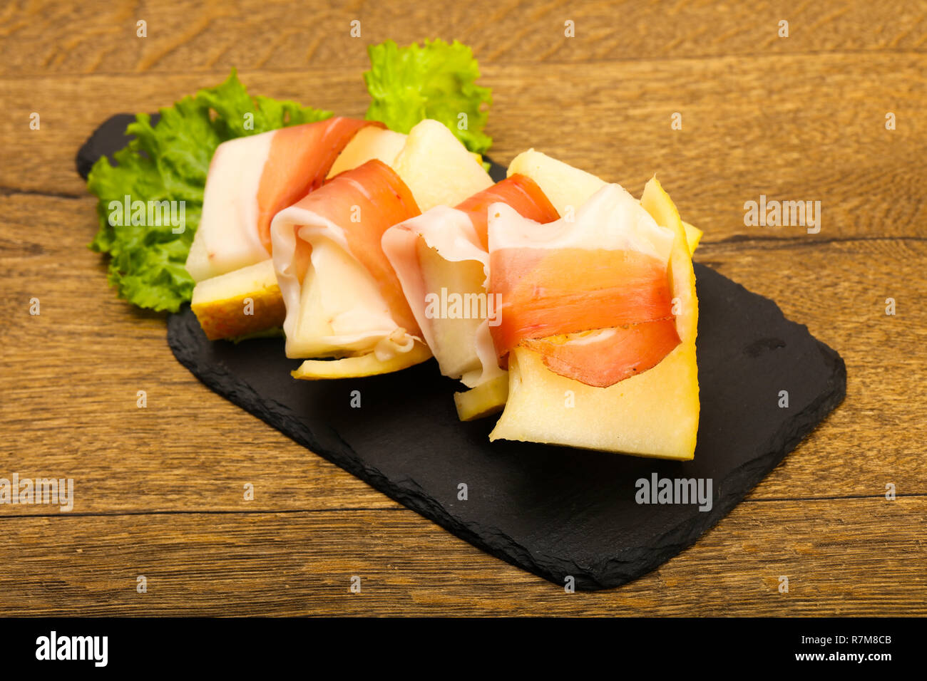 Spanish Hamon with melon Stock Photo - Alamy