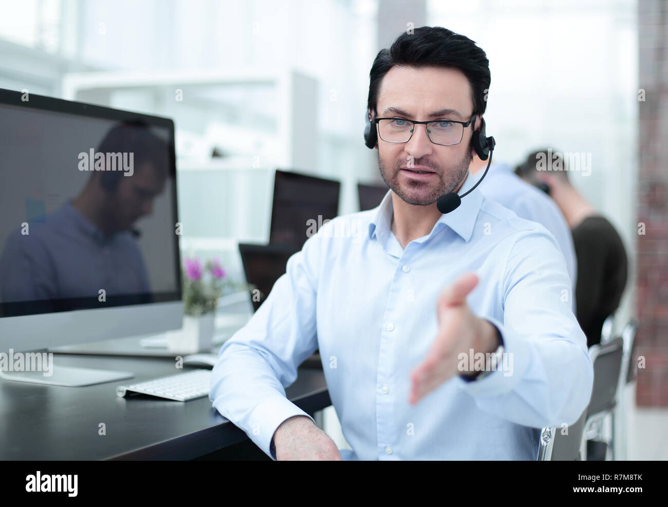 operator call center holding out his hand for a handshake Stock Photo ...