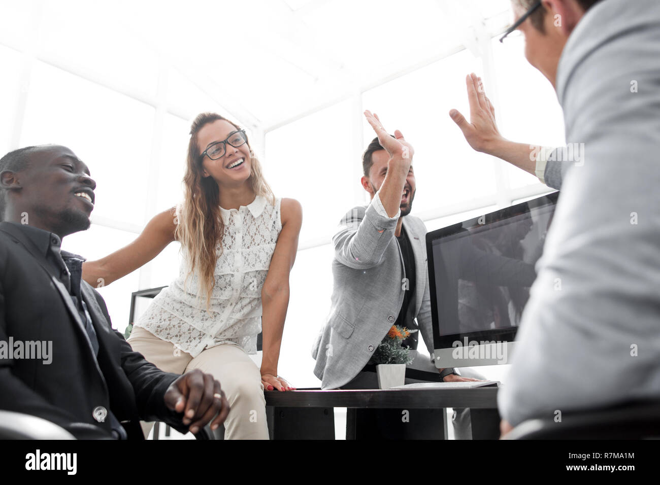 employees greet each other in the office Stock Photo - Alamy