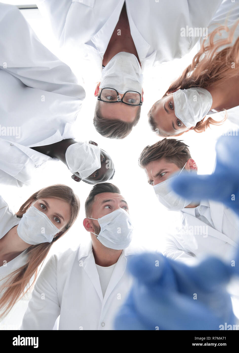 surgeons looking down patient hospital Stock Photo - Alamy