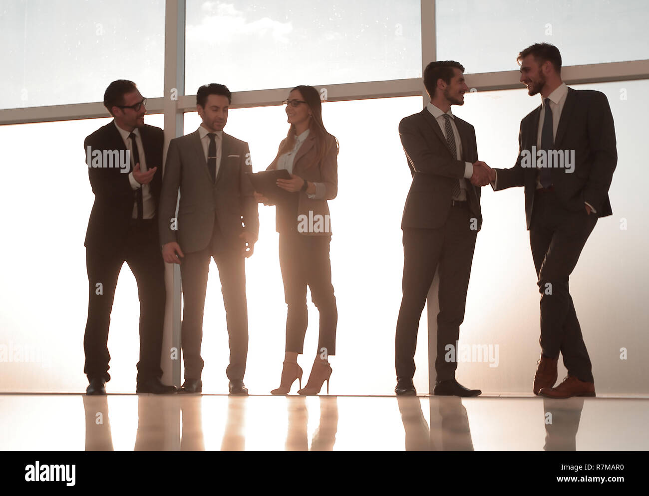 people walk in the office on the sunny background Stock Photo - Alamy