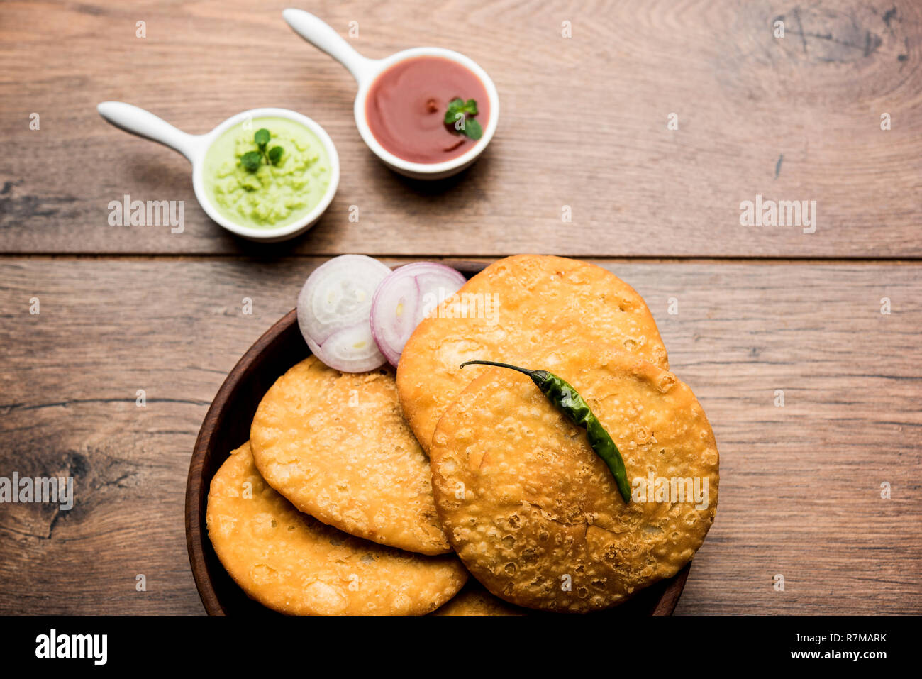 Shegaon or Rajasthani Kachori served with green Chutney and tomato ...