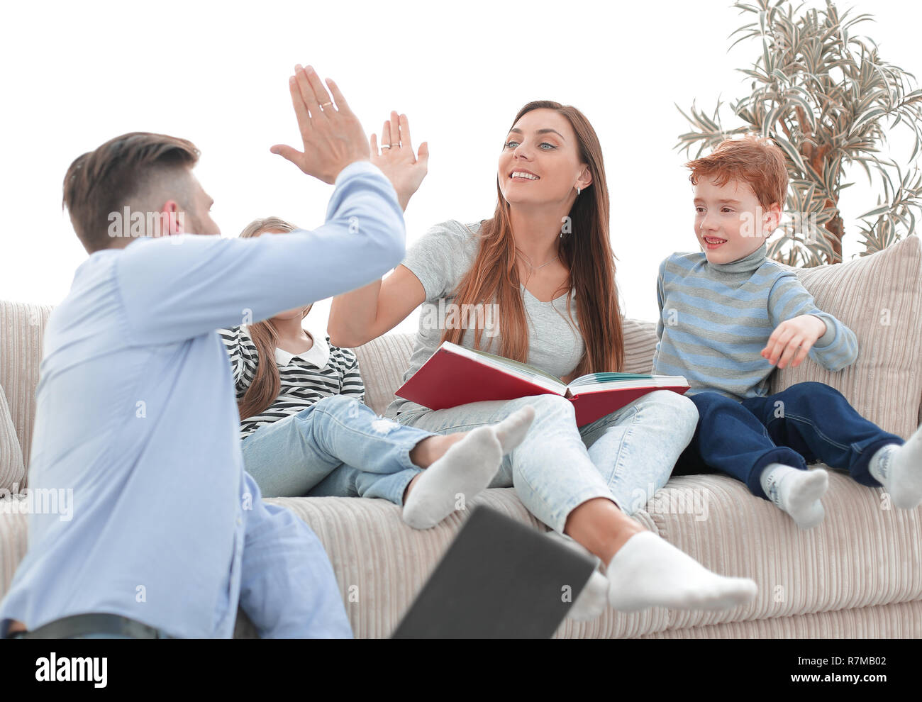 Children high five parents hi-res stock photography and images - Alamy