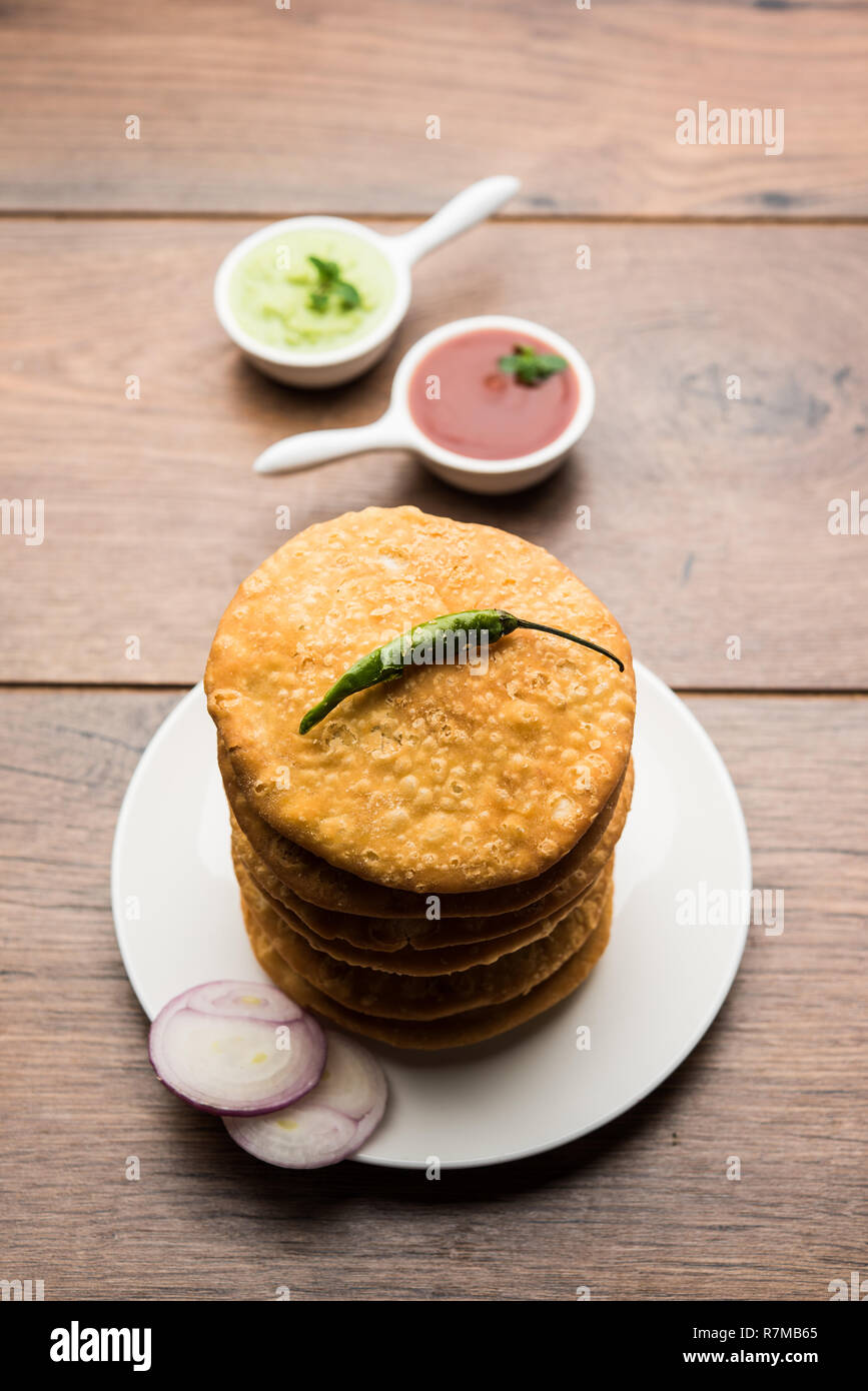 Shegaon or Rajasthani Kachori served with green Chutney and tomato ...