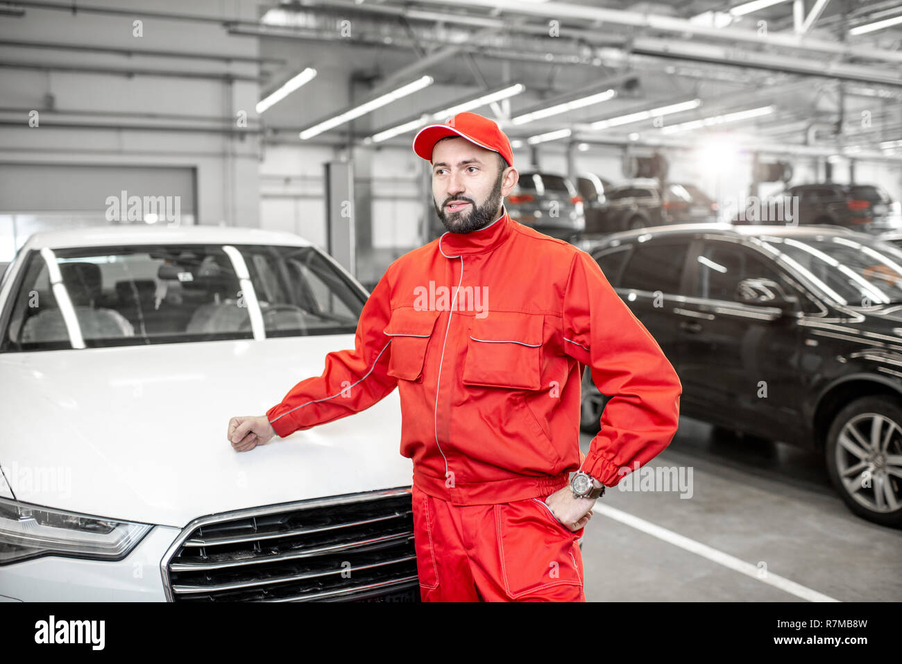 Standing looking automobile uniform hi-res stock photography and images ...