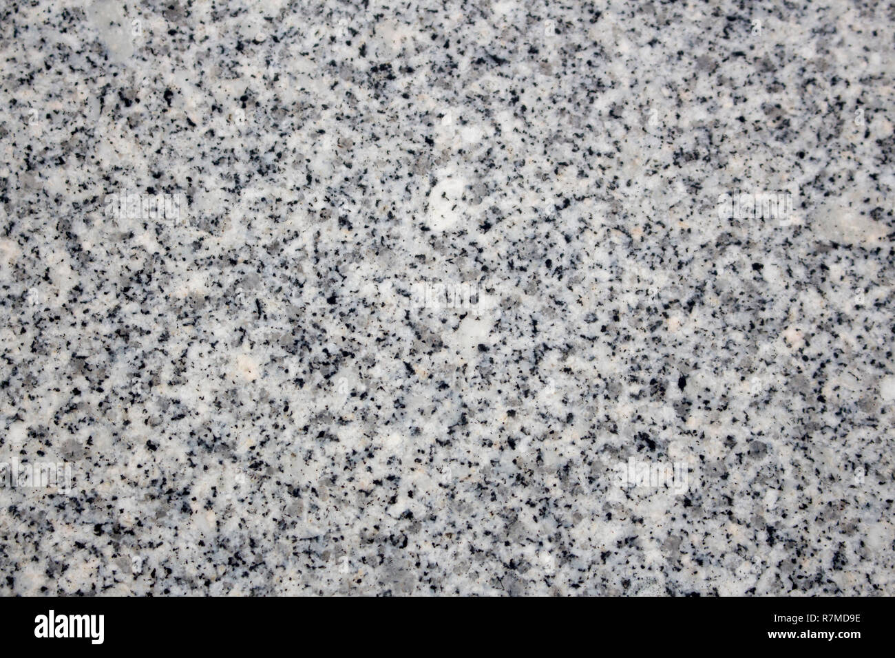Spotted granite stone background. Black, gray and white colored granite ...