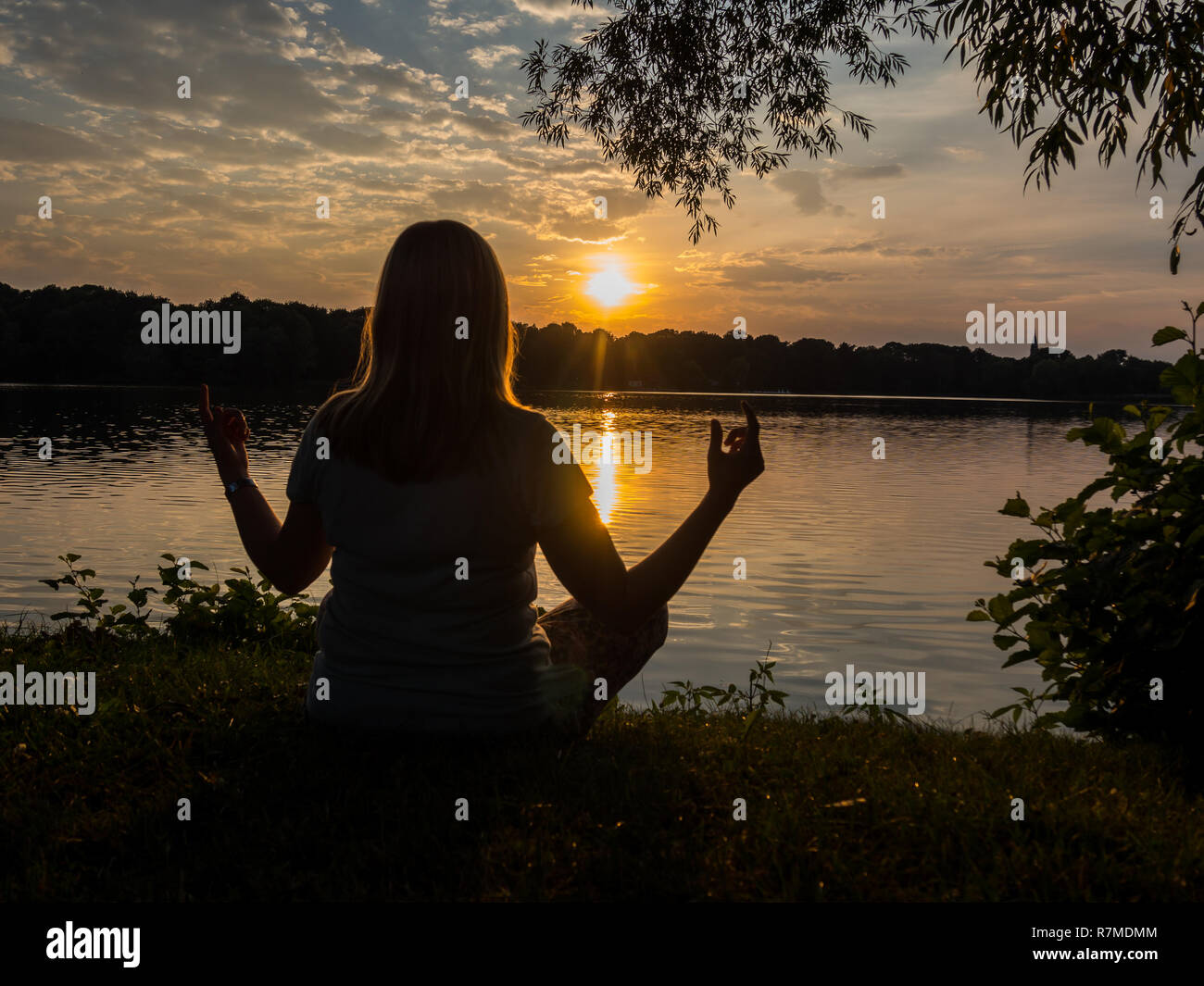 evening woman meditation Stock Photo - Alamy