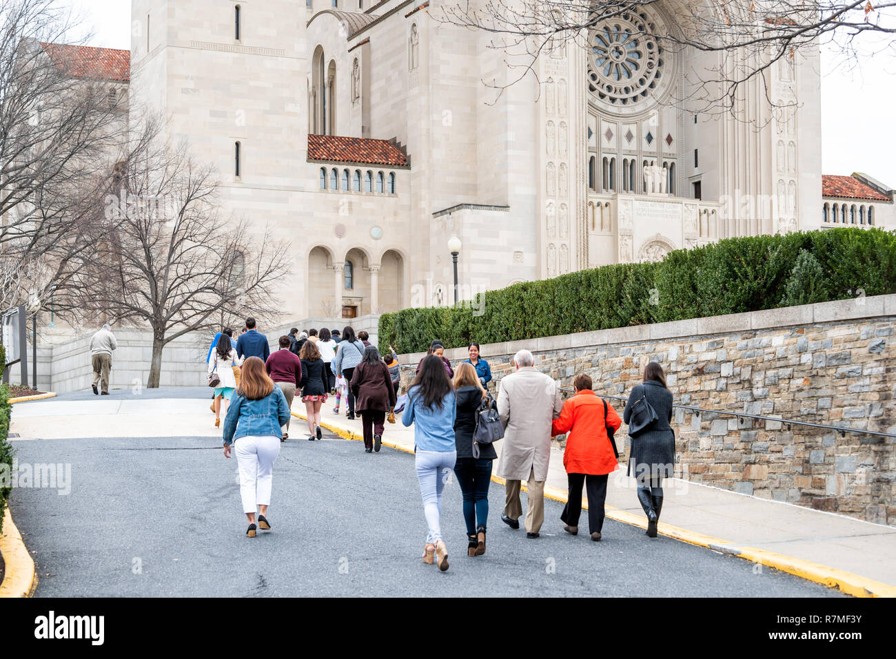 Washington DC, USA - April 1, 2018: Many people walking by the basilica ...