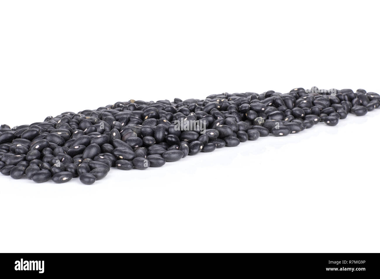 Lot of whole raw black turtle beans line isolated on white background ...