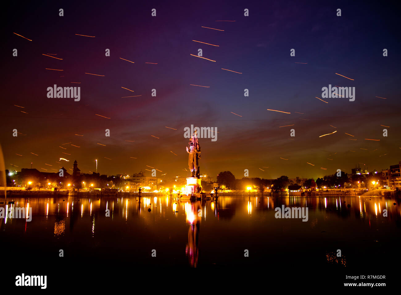 long exposure of spectacular fire trails in the dusk sky caused by fire ...