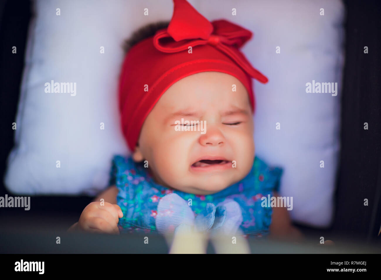 3 month old baby in wheelchair on the street is crying Stock Photo - Alamy