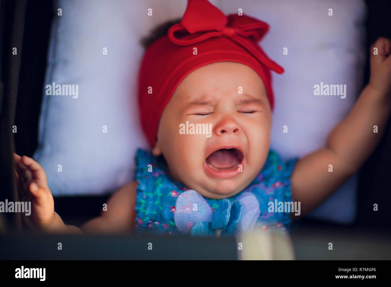 3 month old baby in wheelchair on the street is crying Stock Photo - Alamy