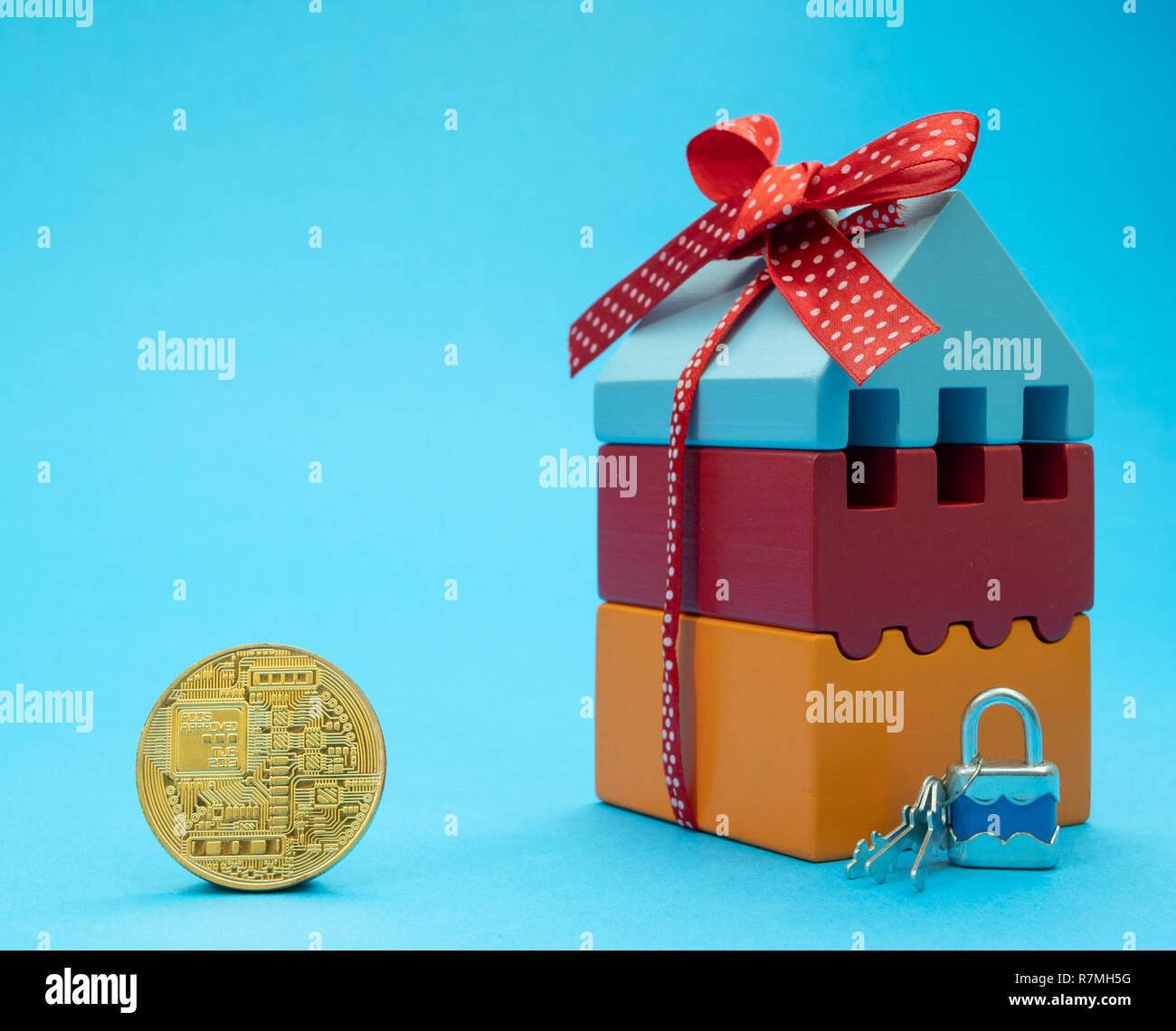 golden coin of cryptocurrency near small house. develop, build, buy ...